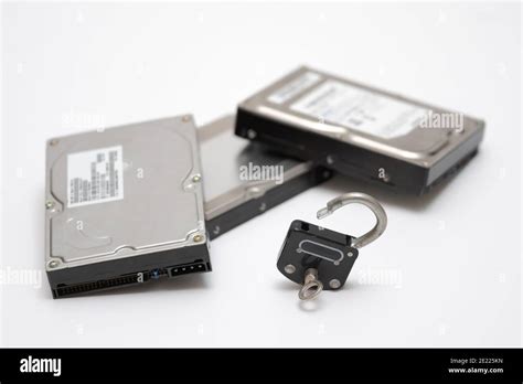 Computer Hard Disks And Open Metal Padlock Symbolizing Concept For Encrypted Data Cyber