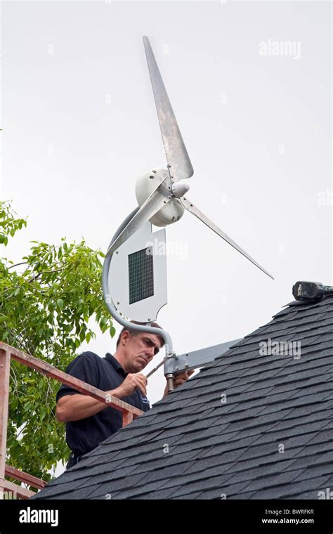 Installation Of A Residential Wind Turbine Is Filmed For An Episode Of