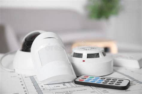 Cctv Camera Remote Control Smoke And Movement Detectors On Building Plan Home Security System