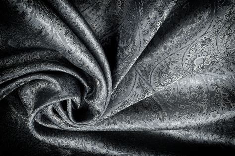 배경 질감 패턴입니다 그레이 페이 즐 리 실크 자 카드 직물에 짠 색조 디자인 복잡 하 게 짠된 반짝 직물 이다 직조 그림자 패턴의 효과 생성 하거나 인쇄 합니다 0명에