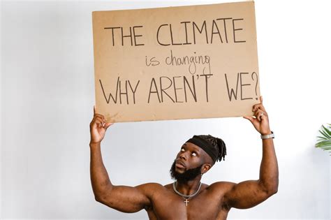 Topless Man Holding A Sign Photos By Canva