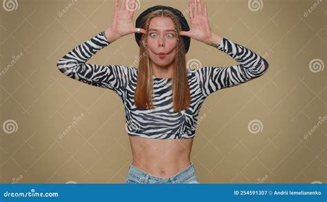 Funny Woman Making Playful Silly Facial Expressions And Grimacing