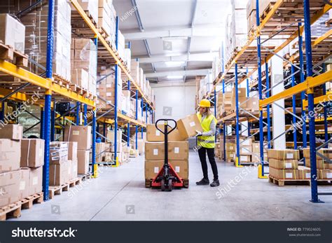 Female Warehouse Worker Loading Unloading Boxes Stock Photo 779024605 Shutterstock