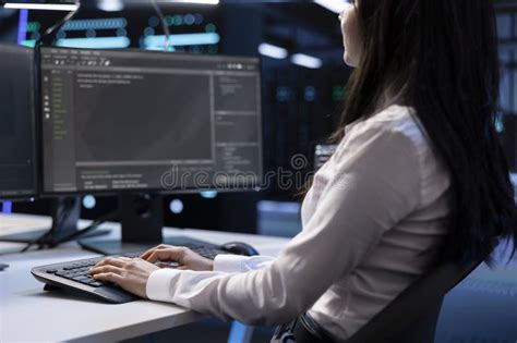 close up shot of software developer in data center typing on keyboard