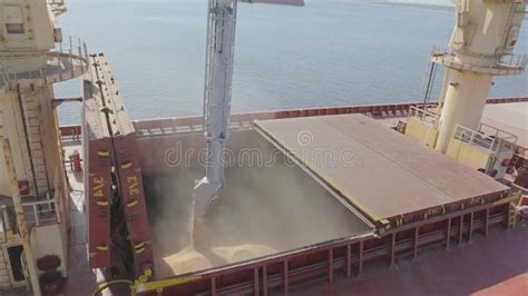 Loading Grain Into A Cargo Ship For Transportation By Sea The Ship Is Loaded With Wheat In The
