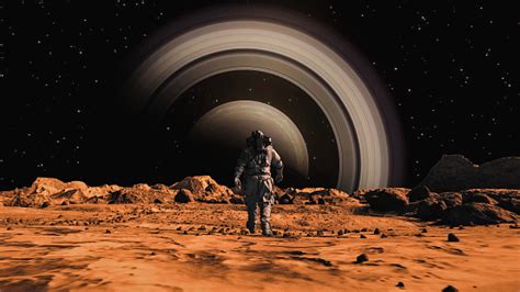 우주복을 입은 용감한 우주비행사들이 화성에서 토성까지 자신있게 걷고 있는 후 바위로 뒤덮인 외계인 붉은 행성 화성에 첫 번째 우주 비행사 첨단 기술 우주 탐사 여행 식민지