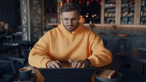 Cinematic Portrait Of Professional Programmer With Laptop In Cafe