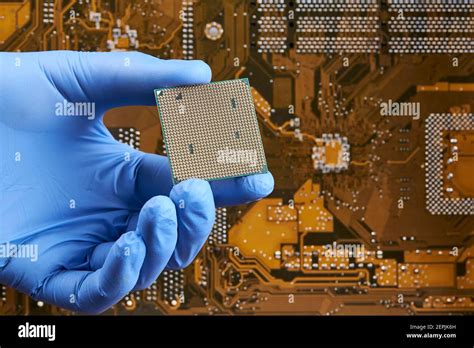 Engineer Person Holds Cpu Central Processor Unit Over Circuit Board Background Hardware