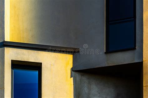 Minimalist Architectural Composition With Bold Shadows Warm Light And Contrasting Window