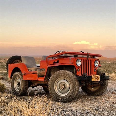 Vintage Jeep Off Road Vehicle Vintage Red Jeep Truck In Countryside