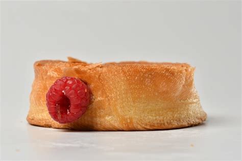 Premium Photo A Raspberry On A Piece Of Bread With A Red Circle On