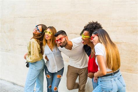 Premium Photo Happy Young People Holding Fake Eyeglasses Having Fun