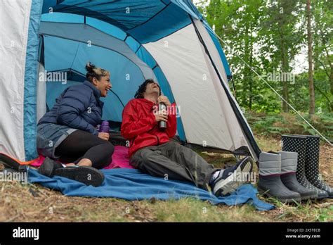 Mother And Son Camping In Forest Stock Photo Alamy