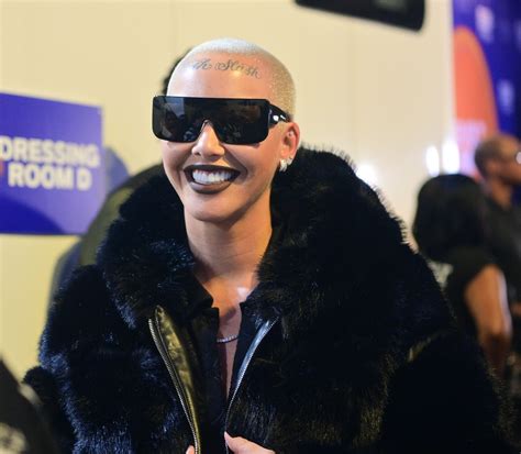 Amber Rose Cross Face Tattoo