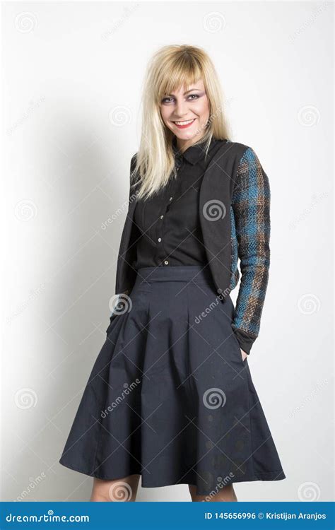 Attractive Fashion Indoor Portrait Of Beautiful Blonde Girl Posing In