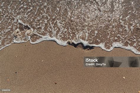 Wave Washes Away The Footprints In The Sand Abstract Background Stock Photo - Download Image Now ...