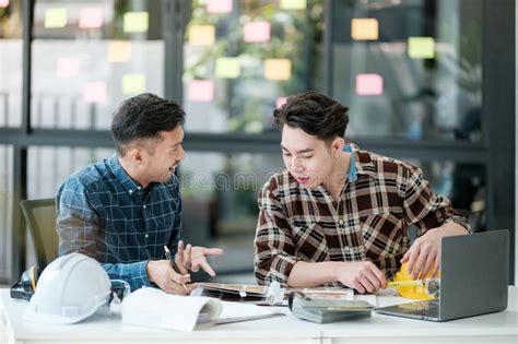 Two Engineers Discussion And Planning About Project Brainstorming Of