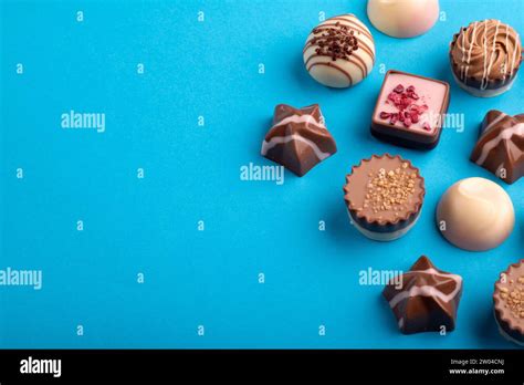 Photo A Set Of Assorted Chocolates Forms A Tempting Array Of Sweet Delights Each Piece With