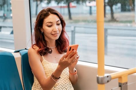 Premium Photo Happy Girl Uses An Application On Her Smartphone To