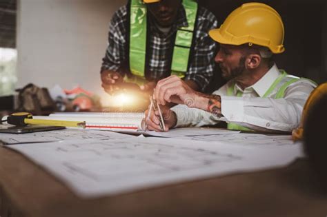 Architect Team Working With Blueprints For Architectural Plan Engineer