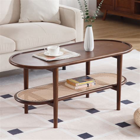 Bay Isle Home™ Arzate Solid Wood Oval Coffee Table With Rattan Shelf Single Coffee Table For