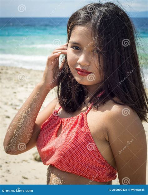 Beautiful Filipina In A Red Swimsuit Posing At A Beach In Capitancillo