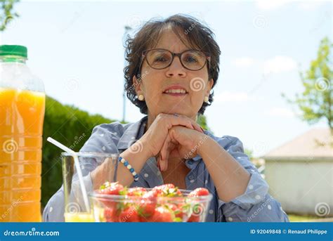 Portrait Of A Mature Brunette Woman With Eyeglasses Outdoor Stock