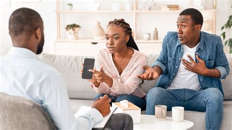 Jealous Wife Angry Woman Showing Phone To Counselor Blaming Husband