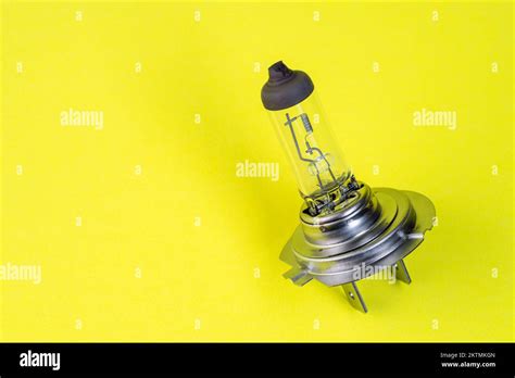 Automotive H7 lamp on color isolated background Stock Photo - Alamy