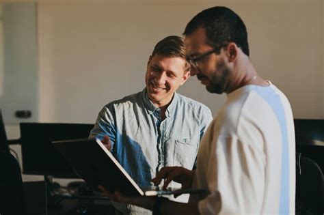 Premium Photo Portrait Of Two Professional Male Programmers Working
