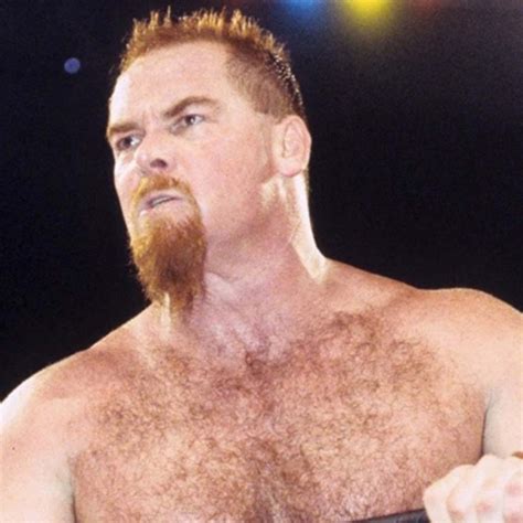 Download Caption Iconic Portrait Of Wrestling Legend Jim Neidhart Wallpaper