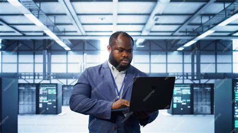 free photo computer scientist in data center using diagnostic tools on laptop