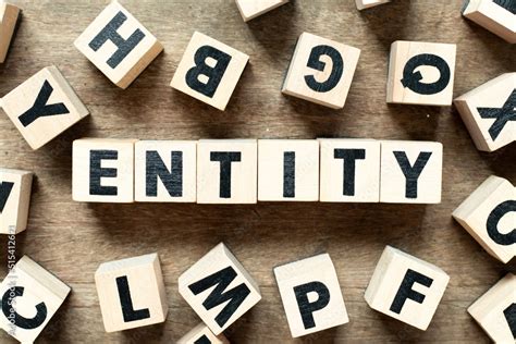 Alphabet Letter Block In Word Entity With Another Block On Wood