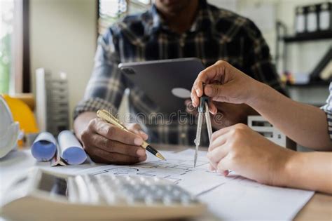 Architect Team Working With Blueprints For Architectural Plan Engineer Sketching A Construction