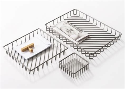 Stacking trays by Frederik Roijé form overlapping grid patterns