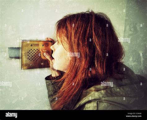 Woman Talking On The Intercom Stock Photo Alamy