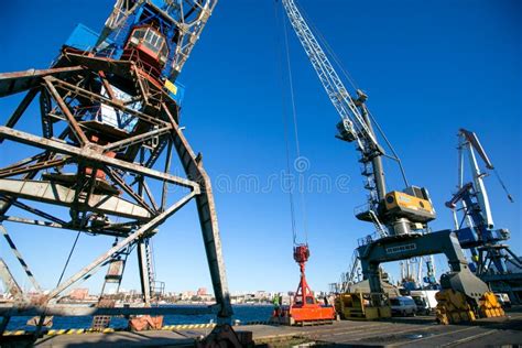 A Crane Performs Loading And Unloading Operations At The Seaport