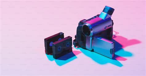 분홍색 배경에 배열된 비디오 카세트와 디지털 비디오 카메라의 클로즈업 보기 사진 Unsplash의 구식 이미지