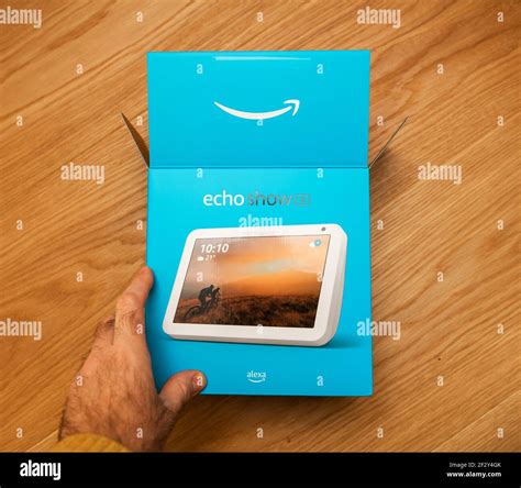 Holding New Amazon Echo Show Smart Speaker That Is Part Of The Amazon Echo Line Of Products With