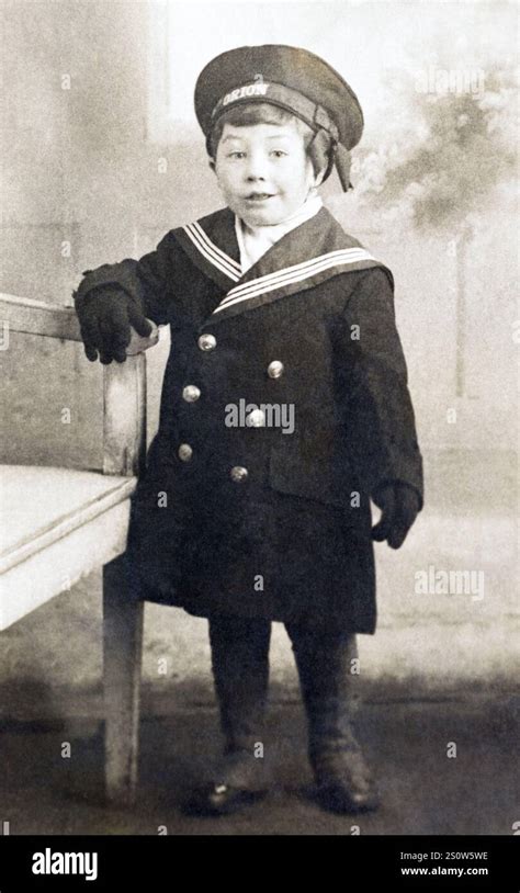 A Small Boy In A Sailor Outfit With A Cap Tally For Hms Orion C 1912