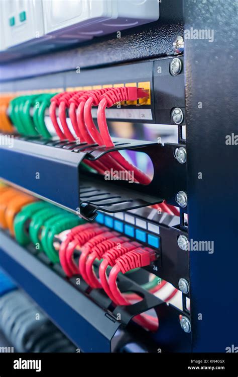 server rack with internet patch cord cables connected to patch panel in