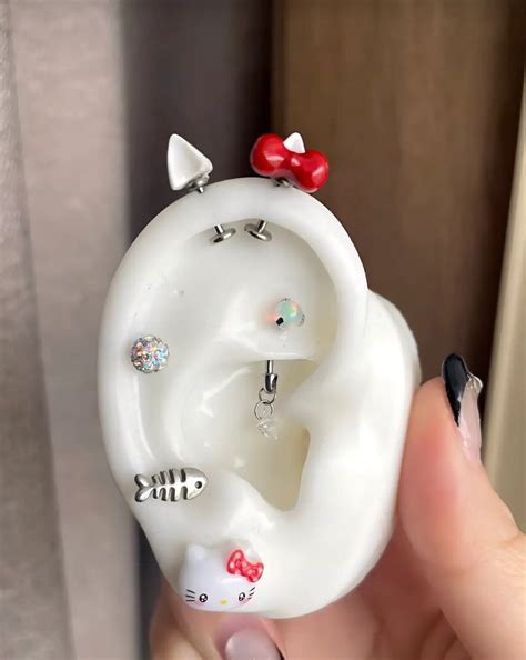 Hello Kitty Piercing 🩰🍡 In 2025 Pretty Ear Piercings Cool Piercings