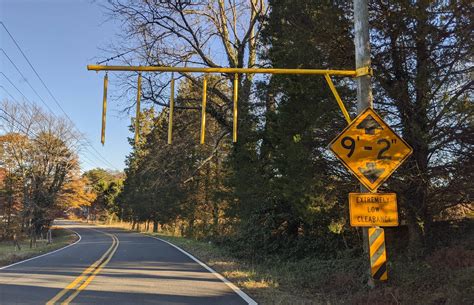 This Low Underpass Uses Hanging Chains To Rattle The Roof As A Warning