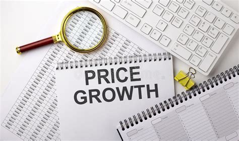 price growth text written on notebook on chart with keyboard and