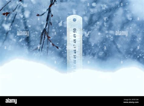 Yardstick Measuring The Depth Of Snow Heavy Snowfall In The Garden Is