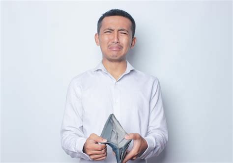 Premium Photo Adult Asian Man Showing His Empty Wallet With Expression