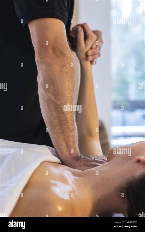 Professional Massage Therapist Working On A Woman Hand Woman Receiving
