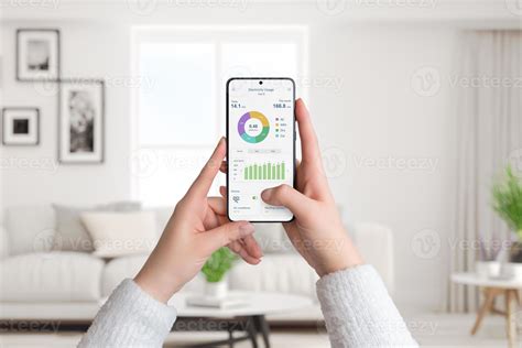 Woman Holds Smartphone With Electricity Usage App Monitoring And