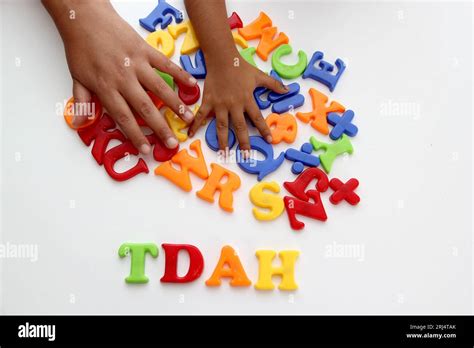 Hands Of Mom And Daughter Playing With Colored Letters That Form Adhd Attention Deficit