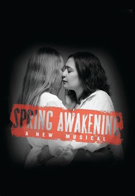 Two Women Are Kissing In Front Of A Red And White Sign That Says Spring Awakening